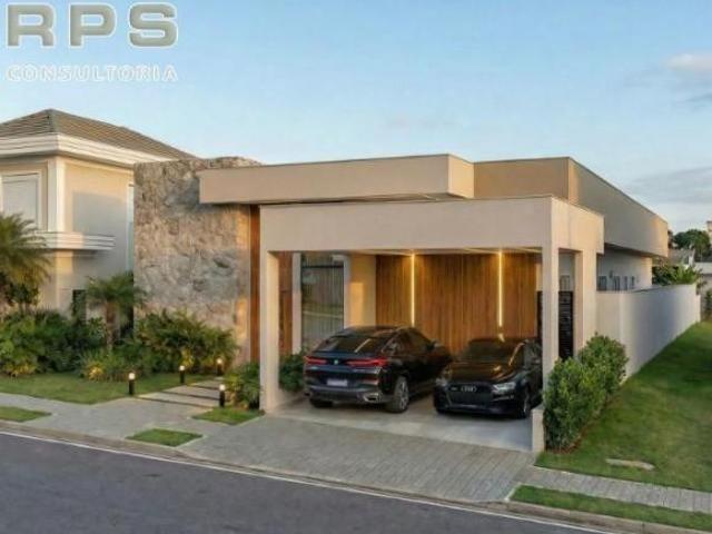 Casa térrea a venda no Condomínio Terras de Atibaia I, com 4 suítes, piscina e pagamento facilitado