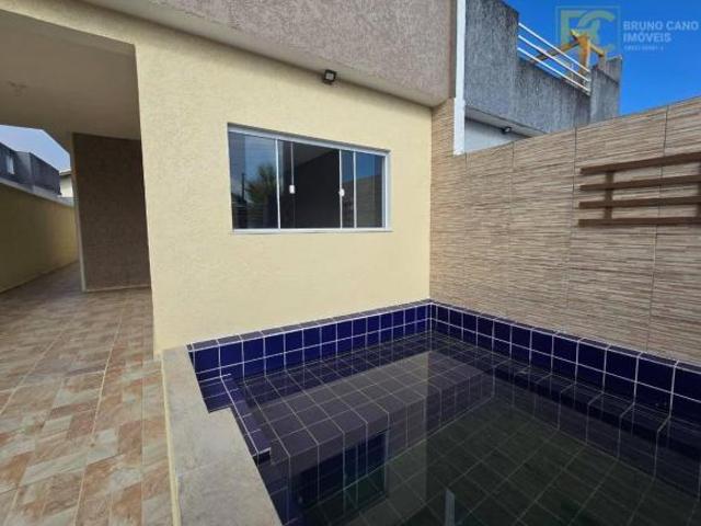 Casa térrea á venda em bairro residencial, com piscina Flora Rica II Peruíbe/SP