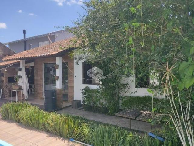Casa térrea Bairro Santa Fé próxima da Rua Santa Fé, com 3 dormitórios, terreno plano
