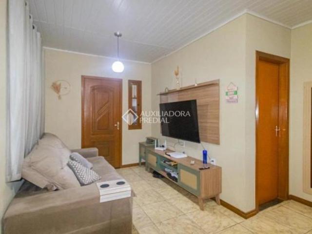Casa térrea com 2 quartos e garagem para 2 carros no bairro Harmonia, em Canoas