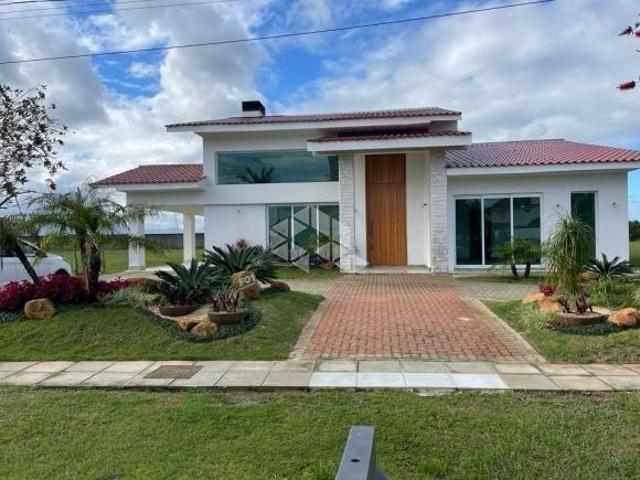 Casa térrea com 7 suítes e 10 vagas no Green Village Golf Club em Xangri lá