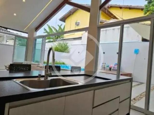 Casa térrea com piscina 3 suítes no condomínio Vila Branca 1 à venda