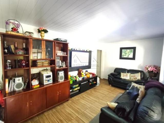 Casa Térrea de 100m² com 2 Dormitórios, Ampla Sala