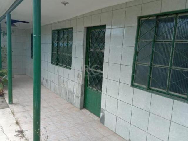 Casa térrea de 30m² toda em piso frio composta por duas suítes, sala e cozinha integradas, área cobe