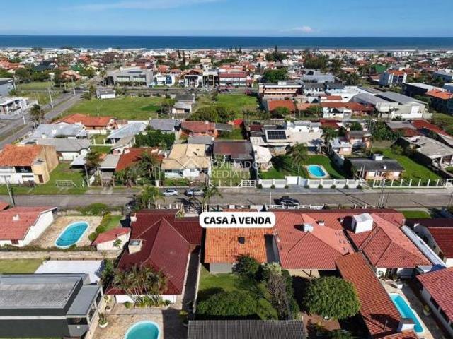CASA TÉRREA NO CENTRO DE XANGRI LÁ, FRENTE LESTE, DIVISA COM ATLÂNTIDA