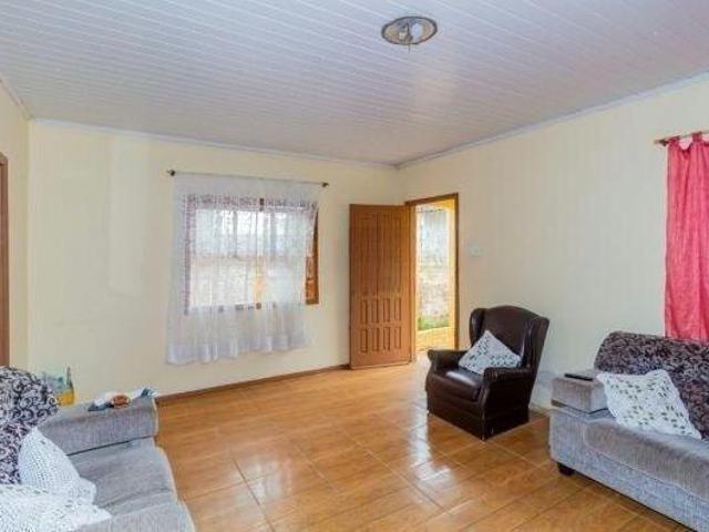 Casa / Terreno com 3 casas de alvenaria no bairro Morro Santana