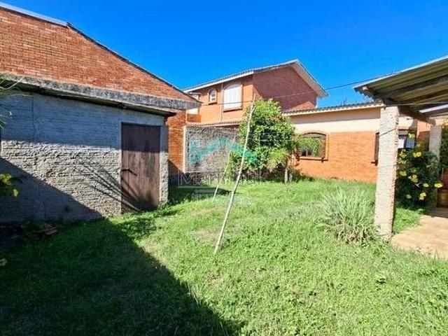 Casa tijolo à vista padrão rústico em laje