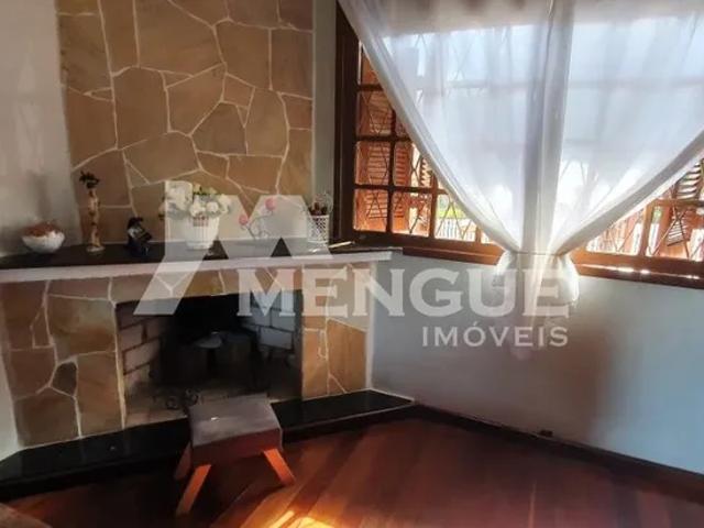 Casa tipo sobrado 4 dormitórios e 2 vagas no bairro Cristo Redentor em Porto Alegre com 265,80m² por