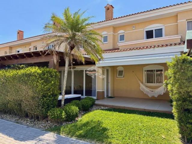 Casa tipo sobrado com 04 dormitórios, 04 suítes, 02 vagas no condomínio Villas Resort em Xangri Lá