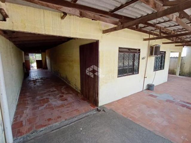 Casa 04 dormitórios com patio e casa auxiliar nos fundos no Harmonia em Canoas