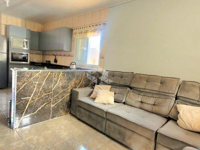 Casa 2 Dormitorios, 4 vagas de garagem à venda em Canoas no bairro Mathias Velho | Casa ampla com pá