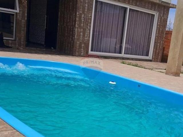 Casa 2 dormitórios com piscina laje 100 metros Mar Murada Capão Novo Capão da Canoa