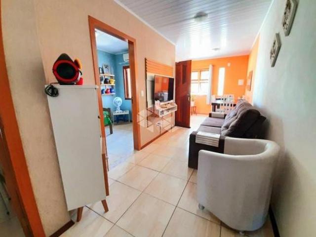 Casa 2 dormitórios, vaga, subsolo e pátio