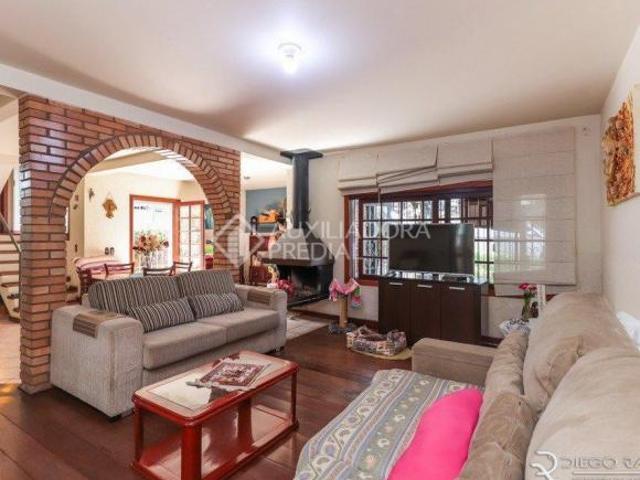 Casa 3 dormitórios, 1 suite, 6 vagas, bairro Auxiliadora, Porto Alegre