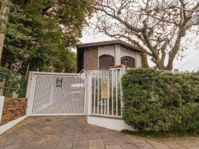 casa 3 dormitórios 326m2 privativos 7 vagas de garagem no bairro Tristeza