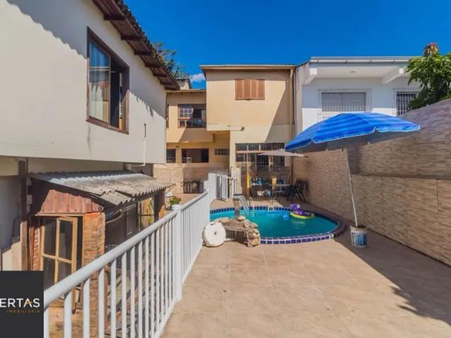 Casa 4 dormitórios à venda no Bairro Nonoai Porto Alegre