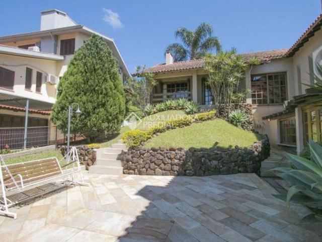 Casa 4 dormitórios 4 suítes, à venda no bairro Cavalhada, Porto Alegre