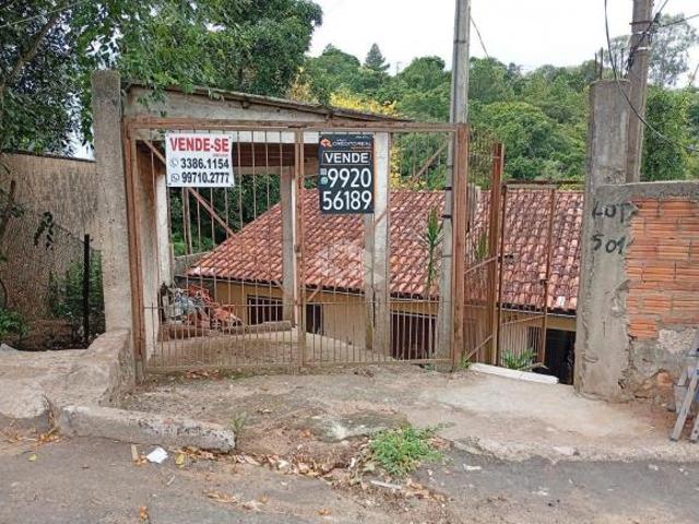 CASA 4 DORMITORIOS COM VAGADE GARAGEM NO BAIRRO JARDIM CARVALHO