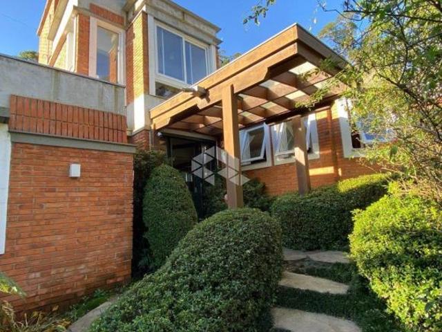Casa 4 dormitórios com 440,16m² privativos no Condomínio Golf Club em Gramado