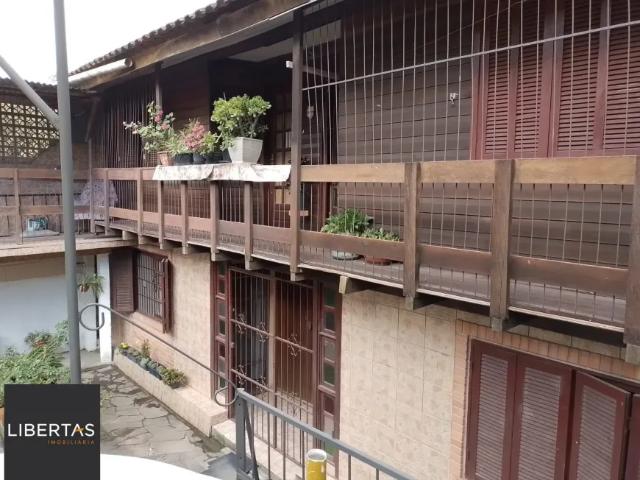 Casa 4 dormitórios à venda Vila Nova Porto Alegre/RS