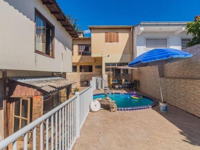 Casa 4 dormitórios à venda no Bairro Nonoai Porto Alegre