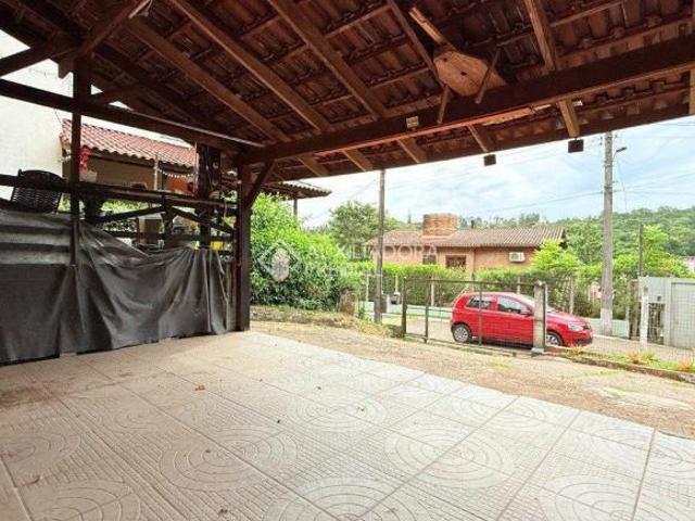 casa 4 dormitórios em condomínio no Teresópolis, com amplo pátio