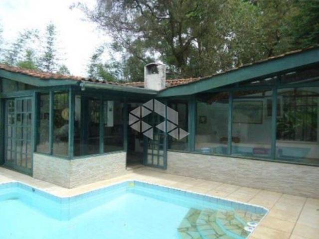 Chácara com benfeitorias residenciais e de lazer em Gravataí RS