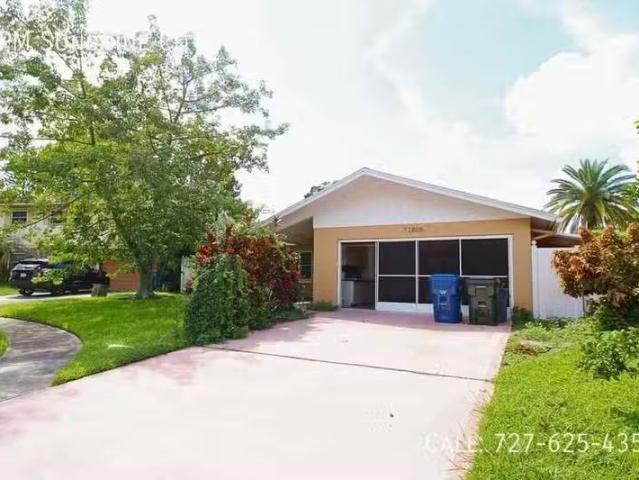 Charming 3 Bed, 3 Bath Home with Screened in Lanai & Pond View.