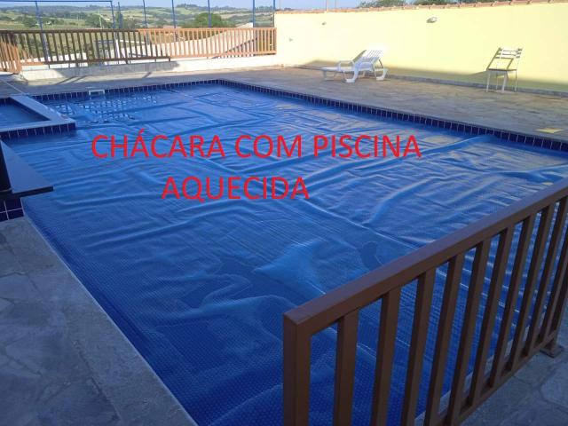 COM PISCINA AQUECIDA. ESTR. ASFALTADA. 3 QUARTOS, 4 BANHEIROS, 2 PISCINAS, BAR MOLHADO, CAMPO, CHURRASQUEIRA, FORNO. COMPLETA PARA LAZER