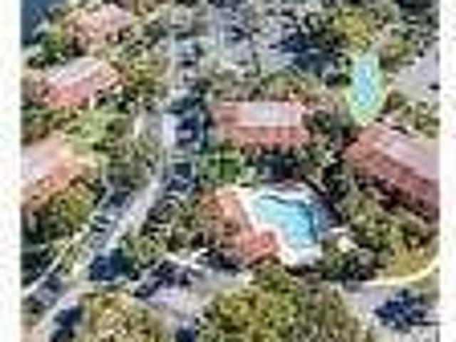 Comfortable 3/2 corner unit. All title floors. Screen balcony