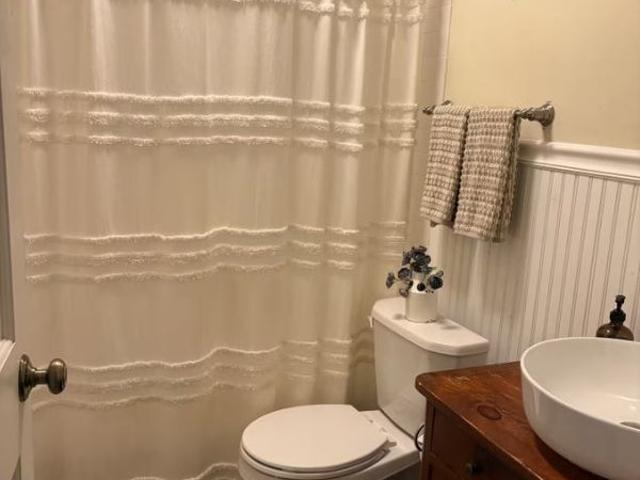 Comfortable furnished bedroom with a private bath