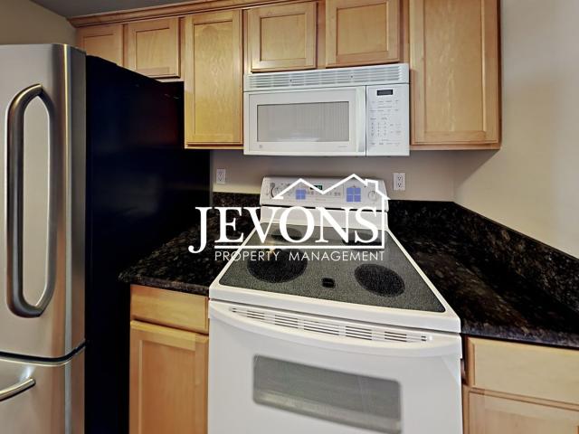 Coming soon! Charming top floor condo with fully equipped kitchen Water, sewer, and garbage included!