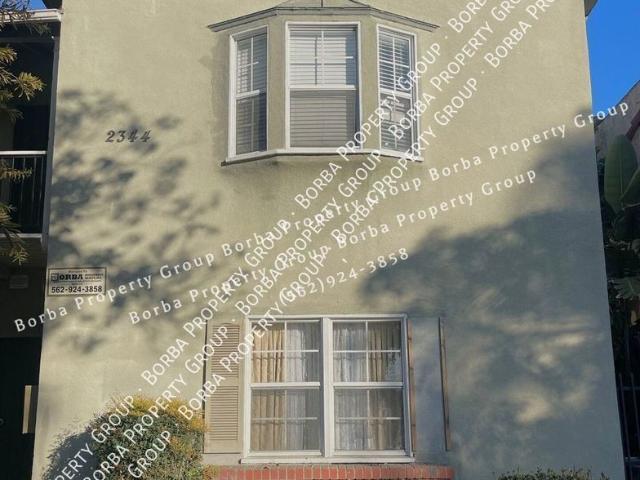 COMING SOON* STUNNING 2 BEDROOM 1 BATH TOP FLOOR UNIT IN GATED BUILDING!