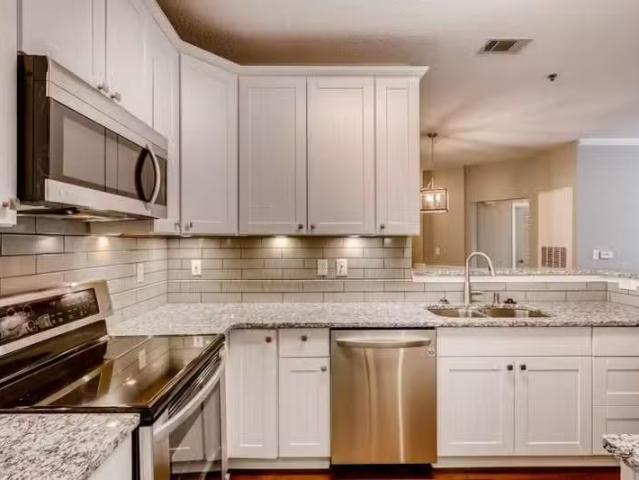 Completely Renovated 2 Bedroom Condo with Garage Poolside Loc.