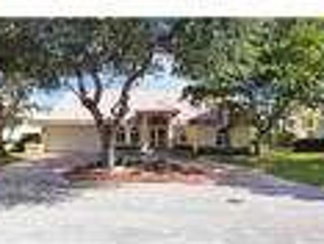 Coral Springs living at its best! This home features 24x24 Travertine marble