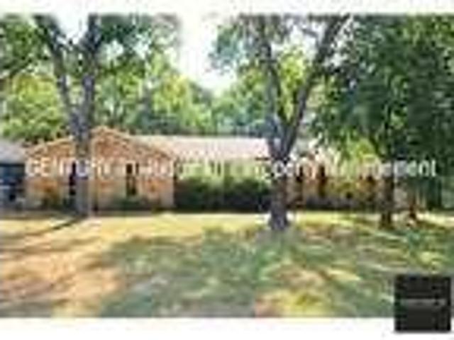 Country living in the city! Mid Century 3/2/2 situated on
