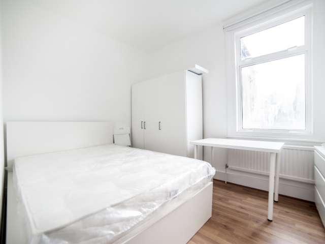 Decorated room in 6 bedroom flat in Wood Green, London