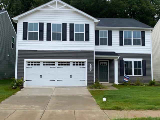 Discover the blend of comfort and convenience in this newly constructed home at Rustling Pines Ct. Enjoy a modern open floor plan, a sleek kitchen equipped with stainless steel appliances, and a large island perfect for entertaining.