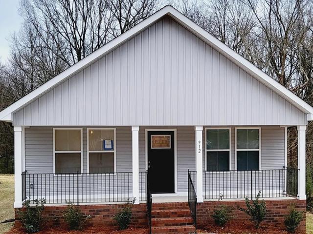 Discover your dream home in Spencer! Immerse yourself in the charm of this stunning open floor plan model with 3 bedrooms, 2 full bathrooms. The home has captivating brand new raised deck overlooking a private and large backyard.