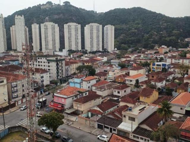 Dois dormitórios, elevador, portaria 24h, garagem demarcada