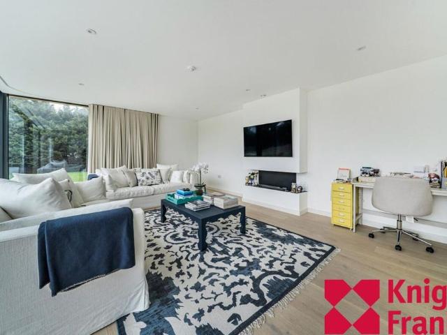 Elegant four bedroom home on the exclusive New Lodge Estate, featuring a bespoke kitchen, private garden, advanced eco friendly technology, and secure access, with pets considered