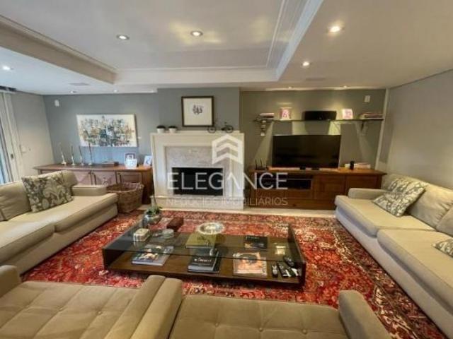 Elegance imóveis vende casa em condomínio de alto padrão,520m², 3 dormitórios, 3 suítes, living de 3