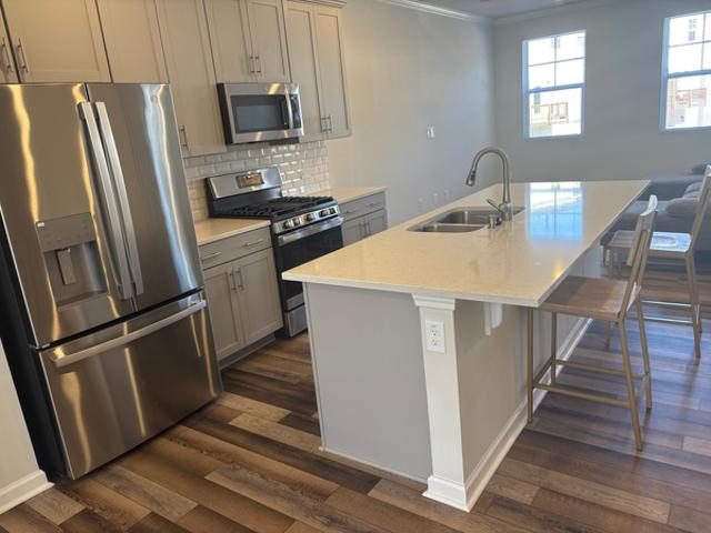 Enjoy a large kitchen and living area on a separate floor, plus garage parking and community pool access. Ideal location just minutes from Brier Creek's shopping, dining, and RTP employment hubs
