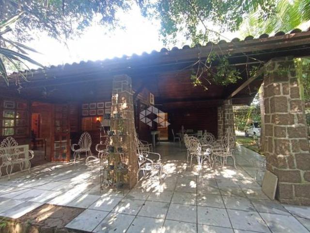 ESPETACULAR TERRENO DE 14.600 M², PARTE FRENTE GUAÍBA, COM CASA PRINCIPAL, CABANA DE VISITAS, SALÃO