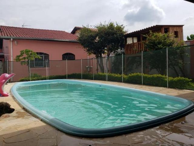 Excelente casa no Jardim Terras de São João / 04 quartos sendo 03 suítes / Piscina aquecida / 408 m²