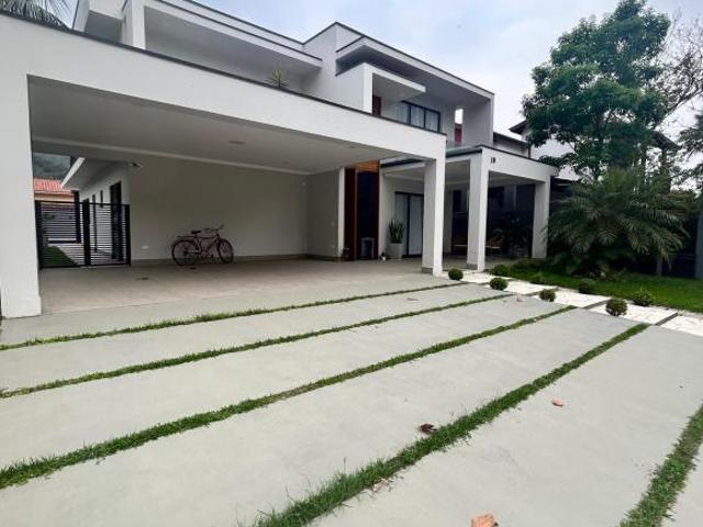 Excelente casa nova com quatro suítes à venda no bairro horto Condomínio Parrk Hillas Horto Ubatuba