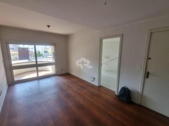 Excelente apartamento com dois dormitórios, living com dois ambientes, sacada com churrasqueira e va