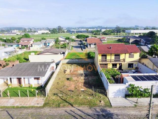 Excelente terreno a venda no Bairro Igra Sul em Torres/RS. De frente para o leste, aterrado e murado