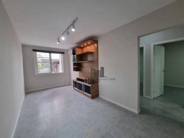 Excelenter apartamento semi mobiliado com 01 box de garagem coberto no Bairro Higienópolis em Porto