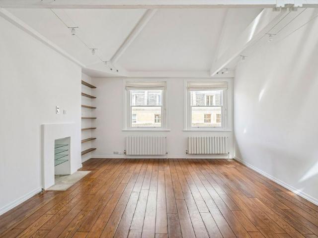 Exceptional two bedroom loft style Kensington apartment with striking vaulted ceilings and a private roof terrace balcony